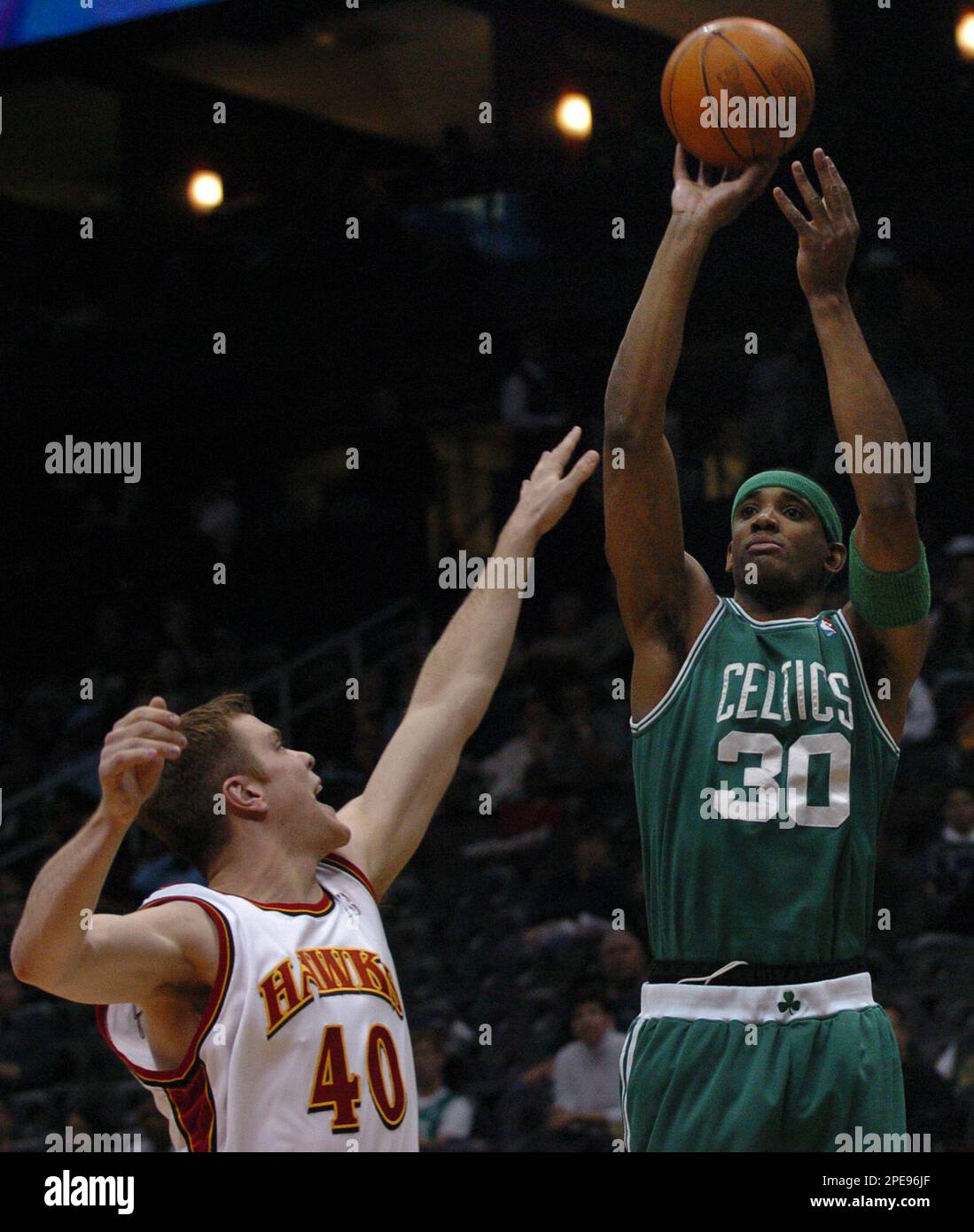 Boston Celtics center Mark Blount (30) takes a shot over Atlanta Hawks ...