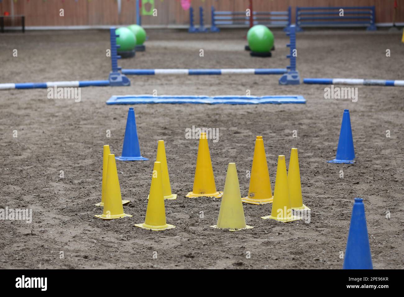 Obstacles and buoys in the sand in an empty equestrian center Stock ...