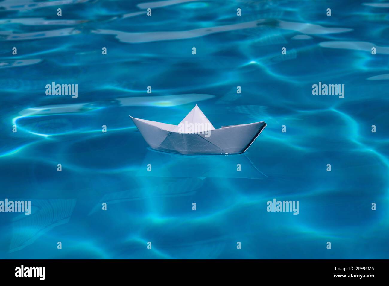 Origami ship. Paper boat on the sea background. Origami paper boat ...