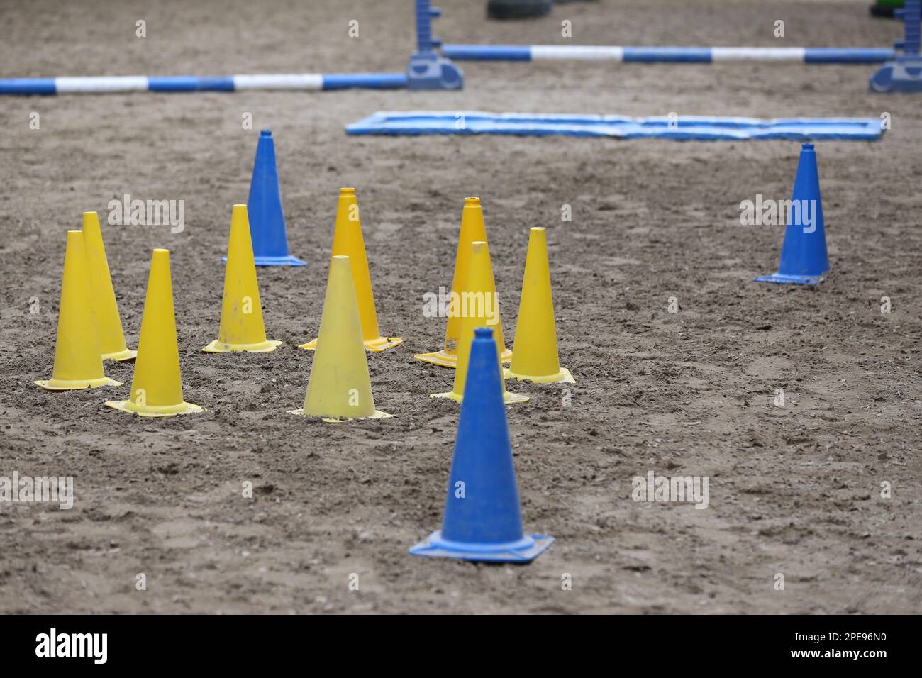 Obstacles and buoys in the sand in an empty equestrian center Stock ...