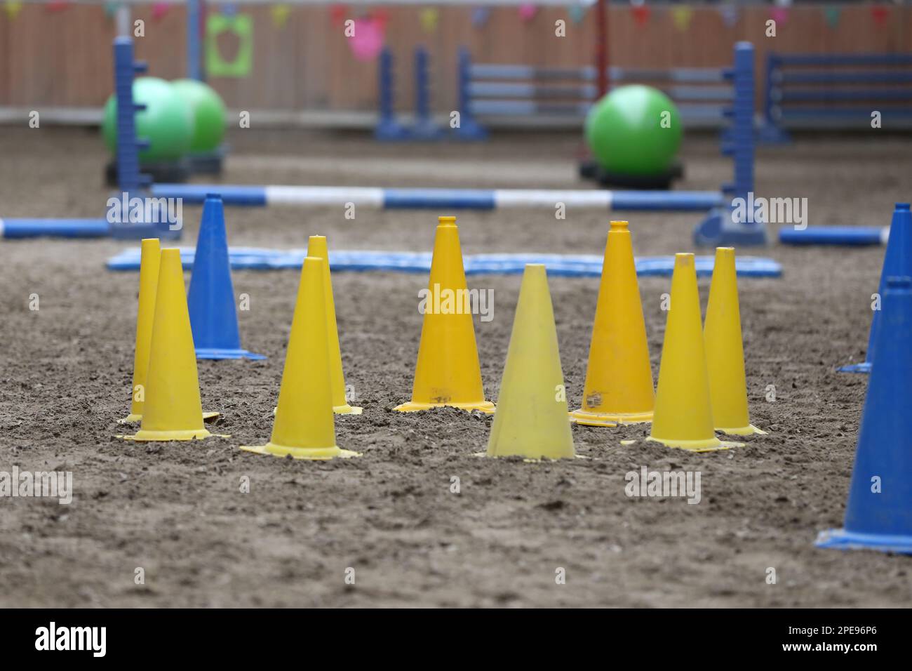Obstacles and buoys in the sand in an empty equestrian center Stock ...