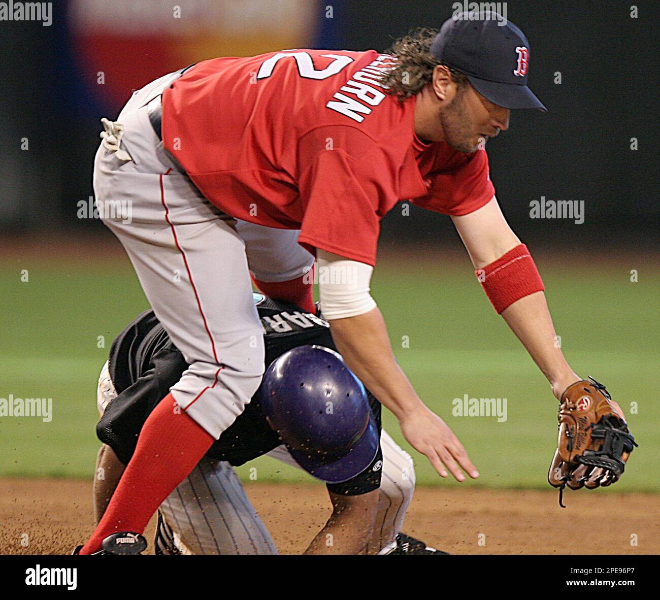 Boston Red Sox second baseman Mark Bellhorn, top, tumbles over Arizona ...
