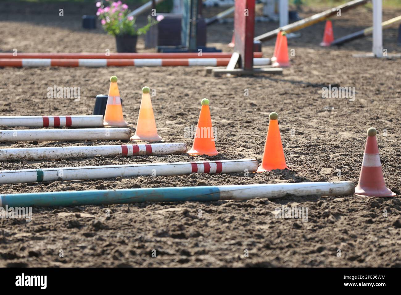Obstacles and buoys in the sand in an empty equestrian center Stock ...
