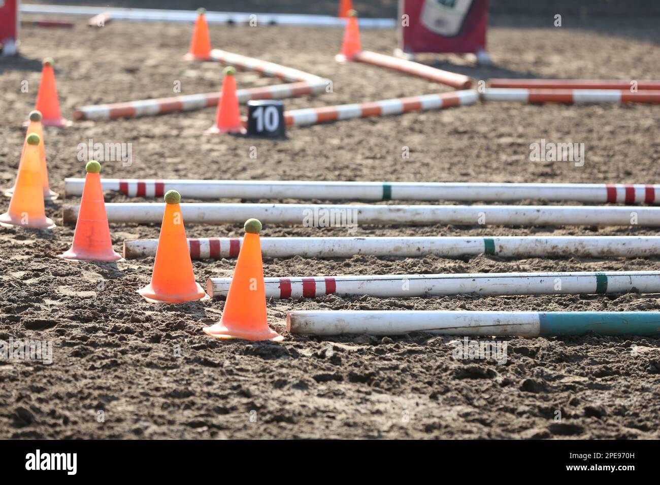 Obstacles and buoys in the sand in an empty equestrian center Stock ...