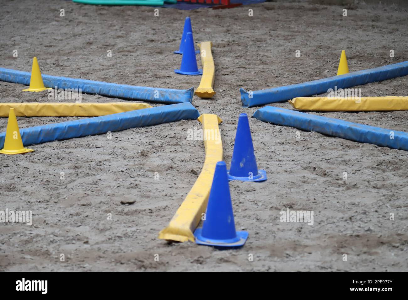 Obstacles and buoys in the sand in an empty equestrian center Stock ...