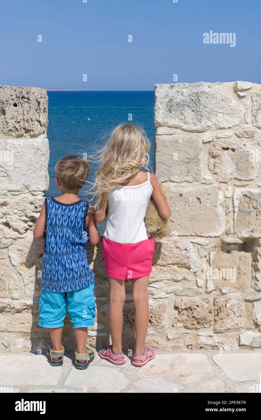 boy and girl looking into the distance Stock Photo - Alamy