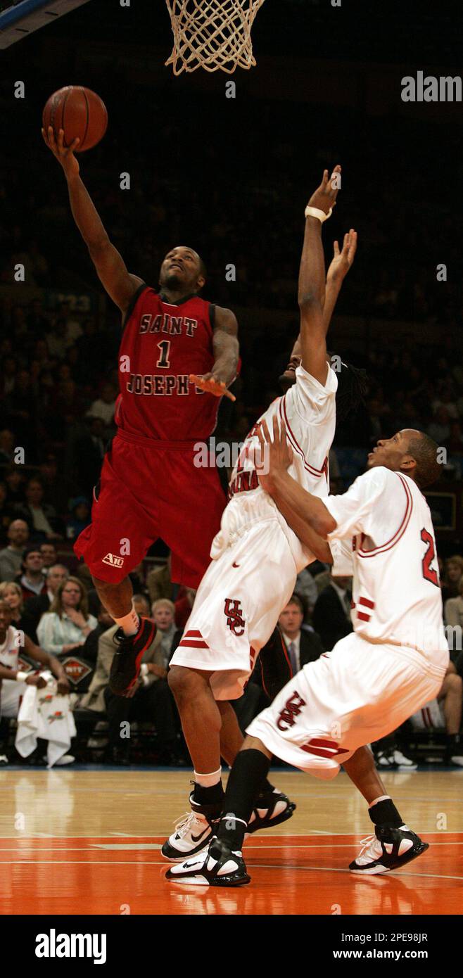 Saint Joseph's Abdulai Jalloh (1) drives past South Carolina's Renaldo ...