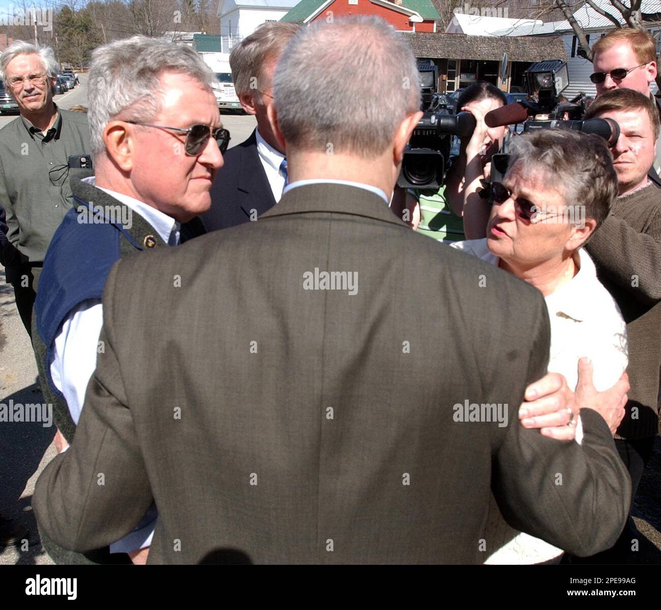 David, left and Ann Scoville, right, hug Attorney General William ...