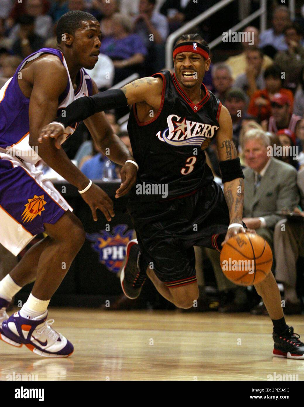 Philadelphia 76ers' Allen Iverson, right, drives the baseline on ...