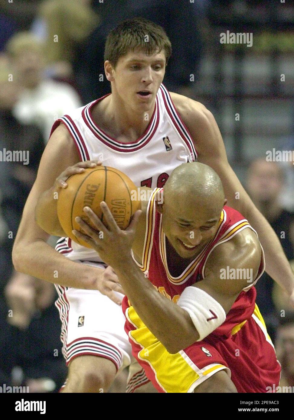 Houston Rockets guard David Wesley, right, tries to hang on to the ball ...