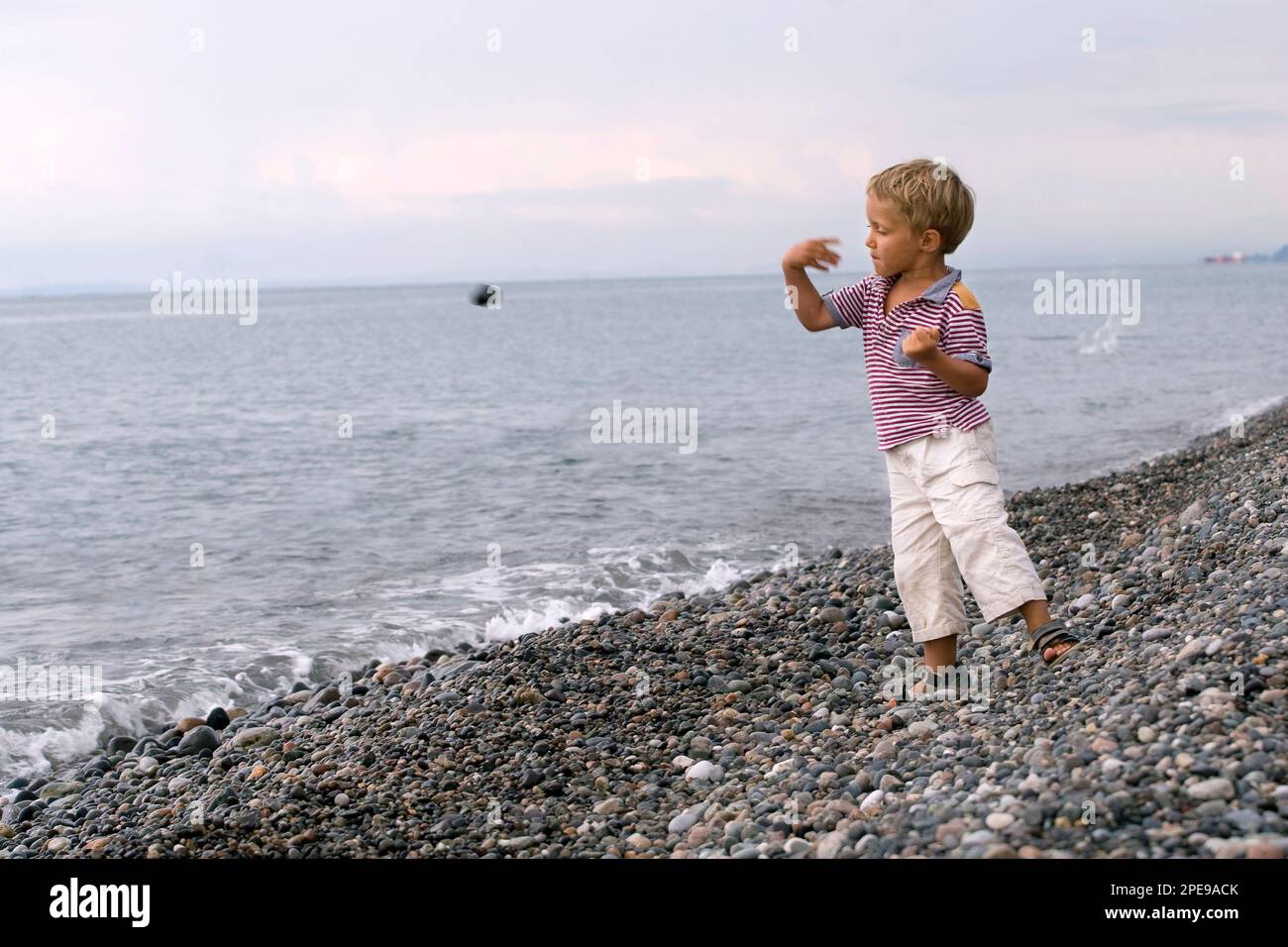 Boy throws stones hi-res stock photography and images - Alamy