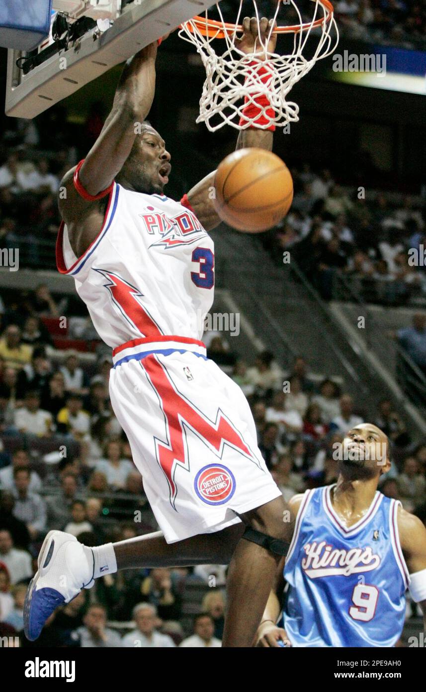 Detroit Pistons center Ben Wallace dunks over Sacramento Kings forward ...