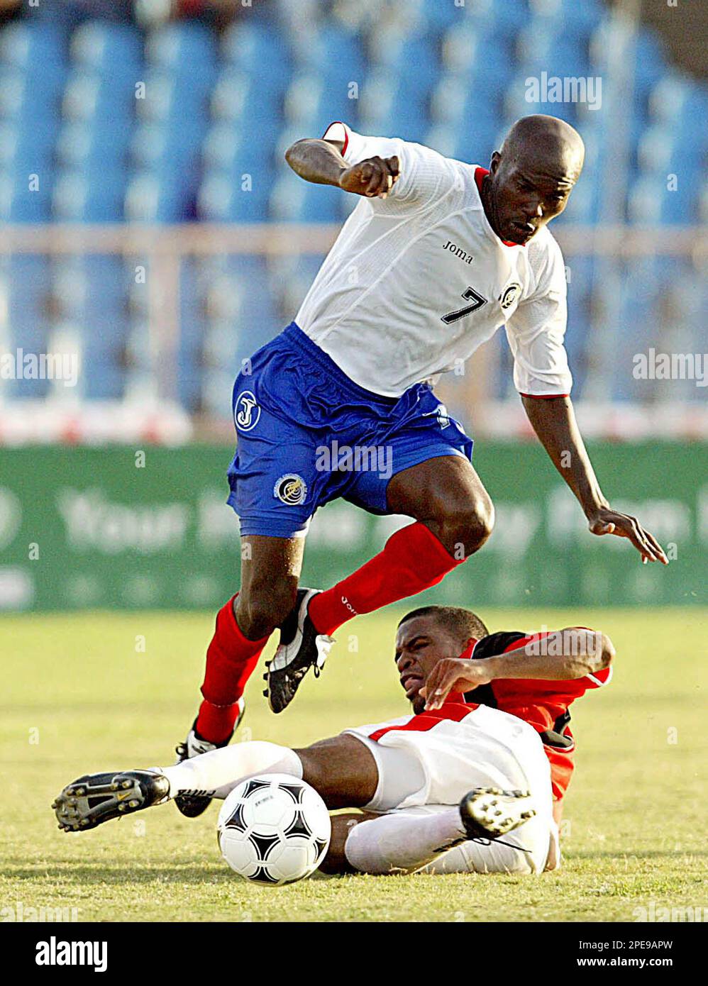 Costa Rica's Whayne Wilson hurdles the challenge of Trinidad and Tobago ...