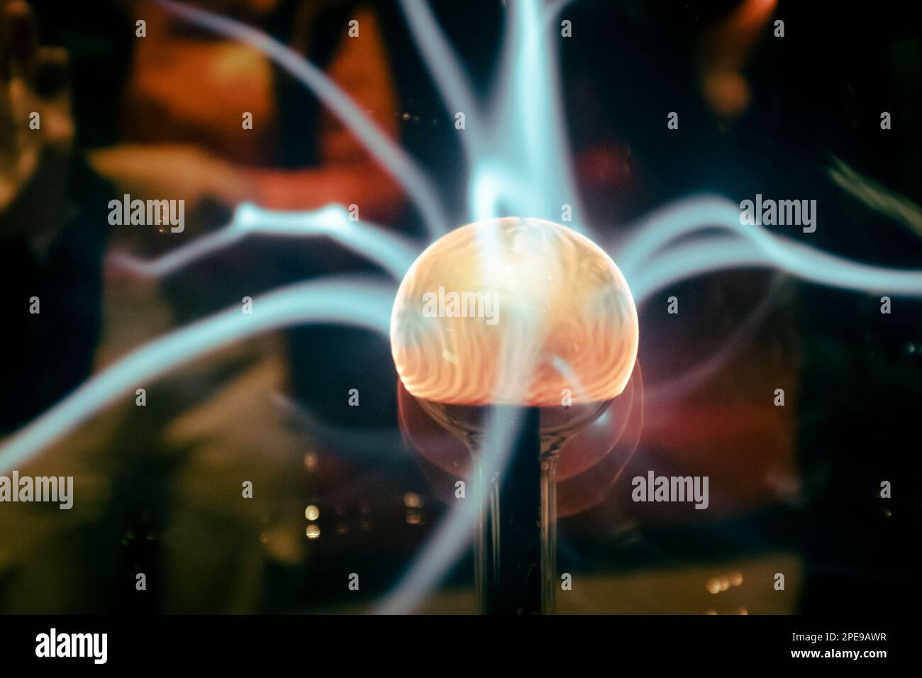 Energy lightning rays from an orange core sphere Stock Photo - Alamy