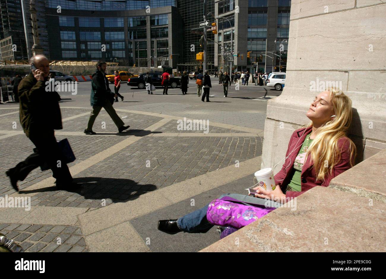 Sheila Joy of New York, soaks up the sun at Columbus Circle in New York ...