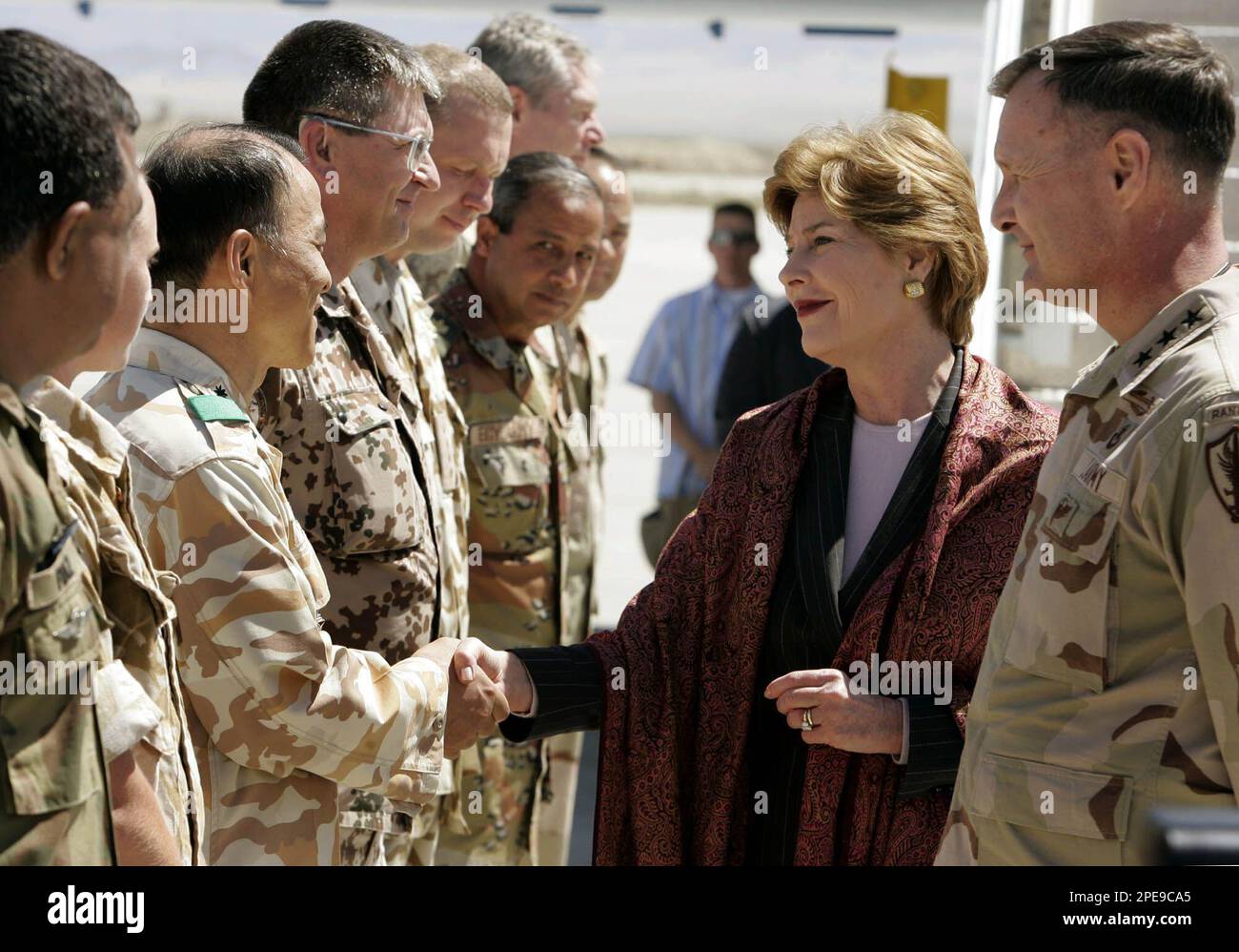 U.S. first lady Laura Bush, second right, meets coalition troops upon ...