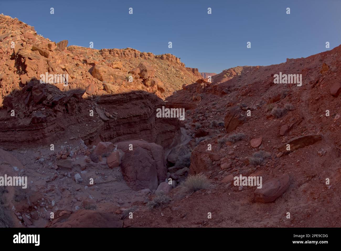 Narrow slot canyon, filled with giant boulders, that leads to the dry ...