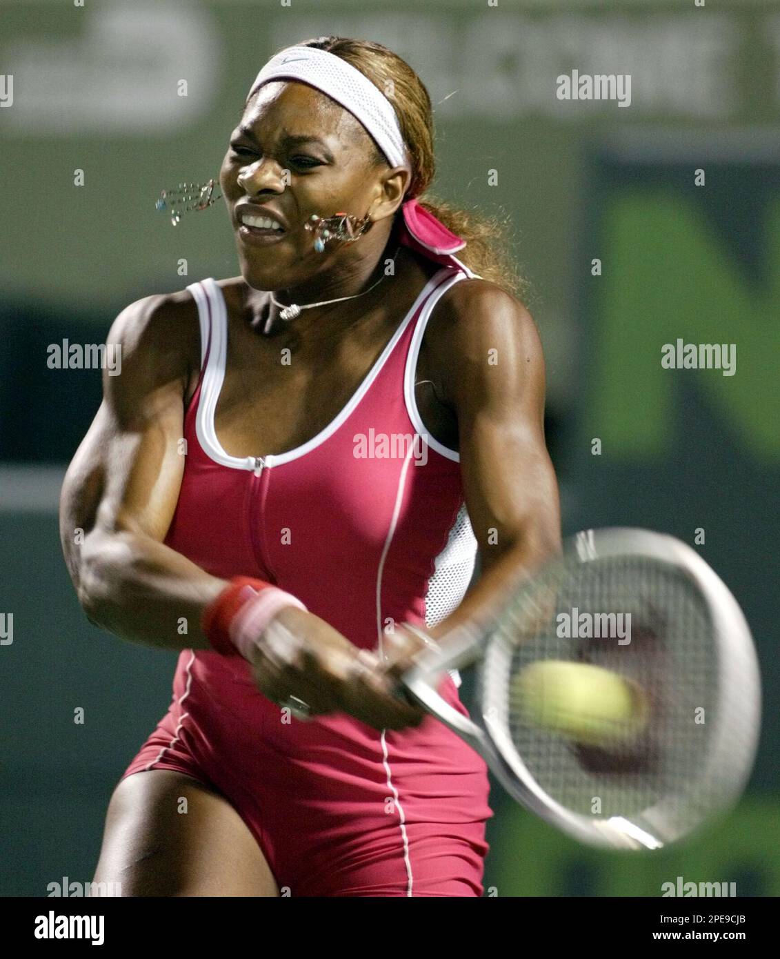 Serena Williams returns a shot from her sister, Venus Williams, at the ...