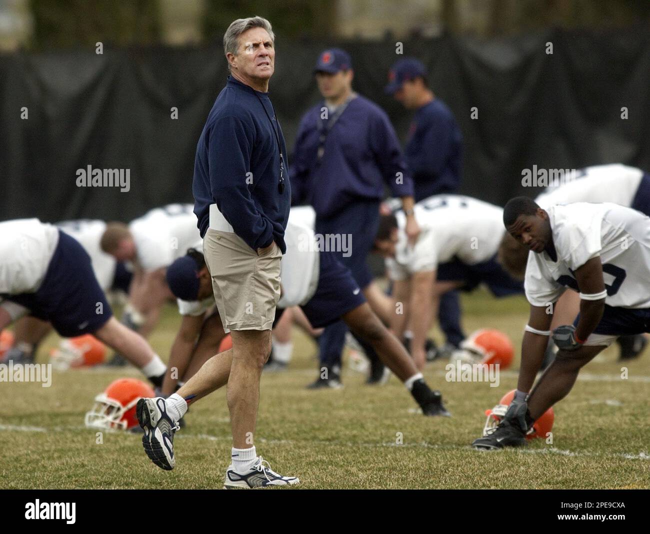Illinois football coach Ron Zook paces between rows of players during ...