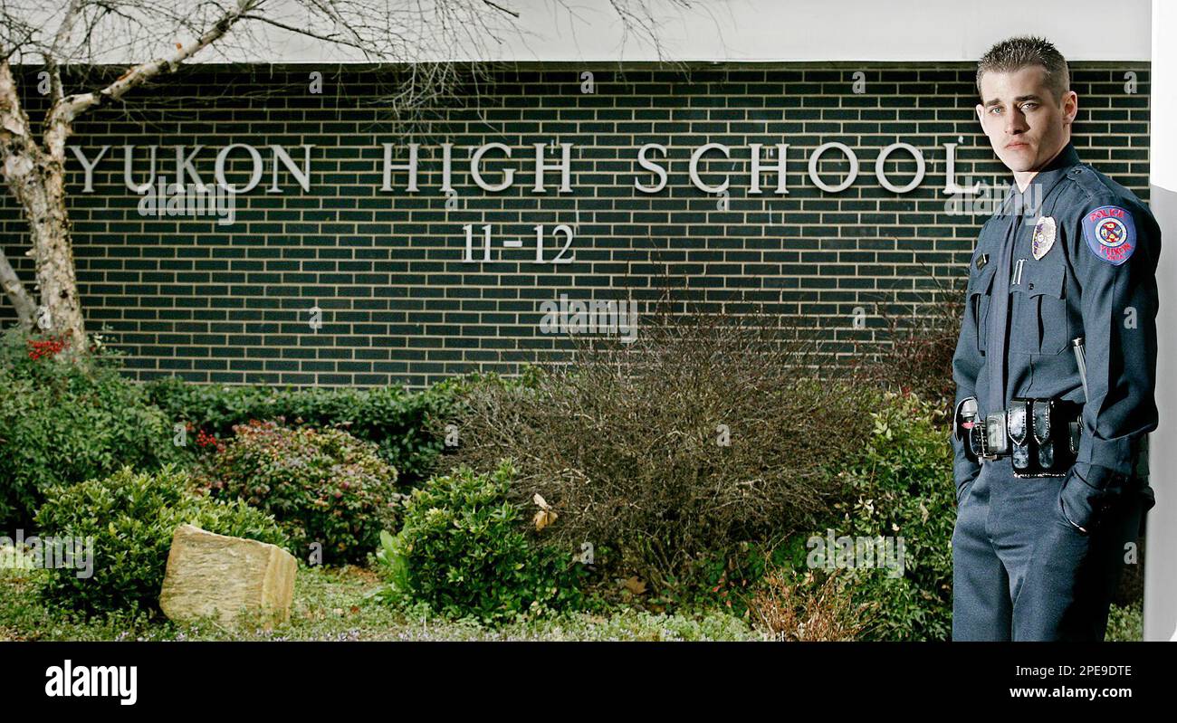 Yukon, Okla. police officer Andy Henderson, 26, poses is uniform ...