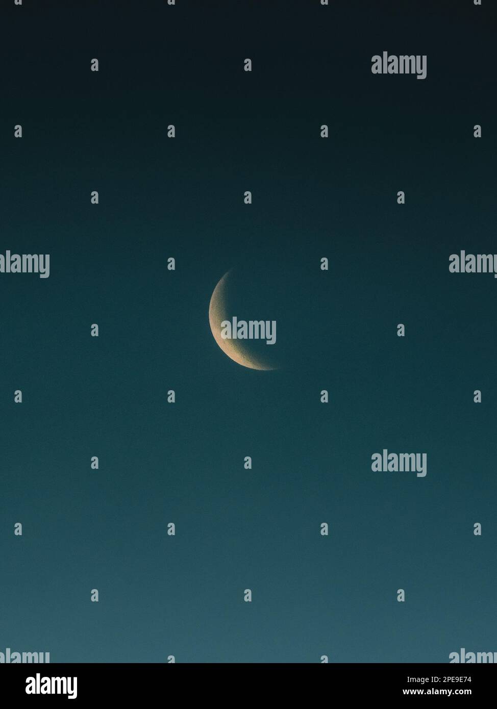 The small and yellow shining moon Stock Photo - Alamy