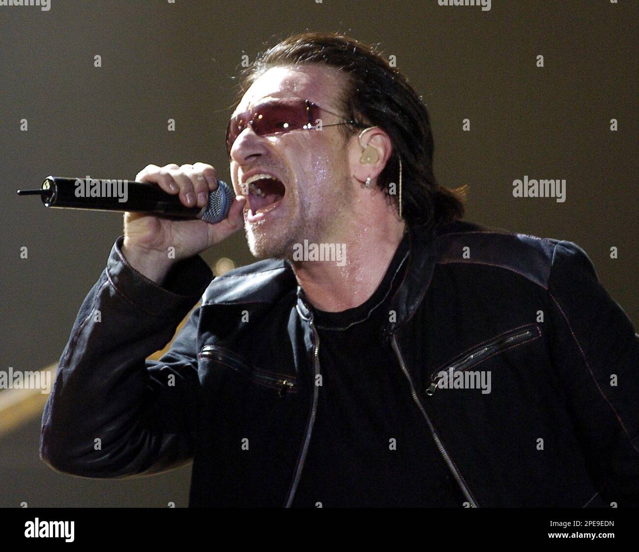 U2 singer Bono sings during the first concert of their Vertigo Tour at ...