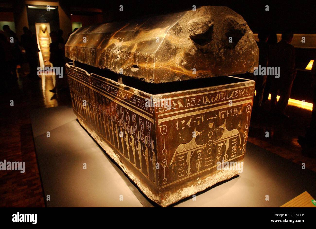 Visitors roam around the coffin of Ankh-Hor during the inauguration of ...