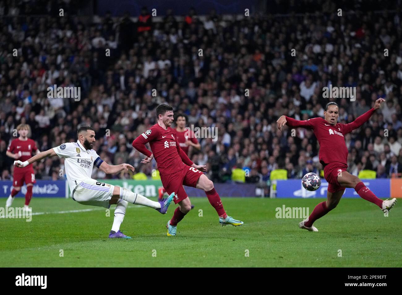 Liverpool's Virgil van Dijk, right, tries to block a shot by Real ...