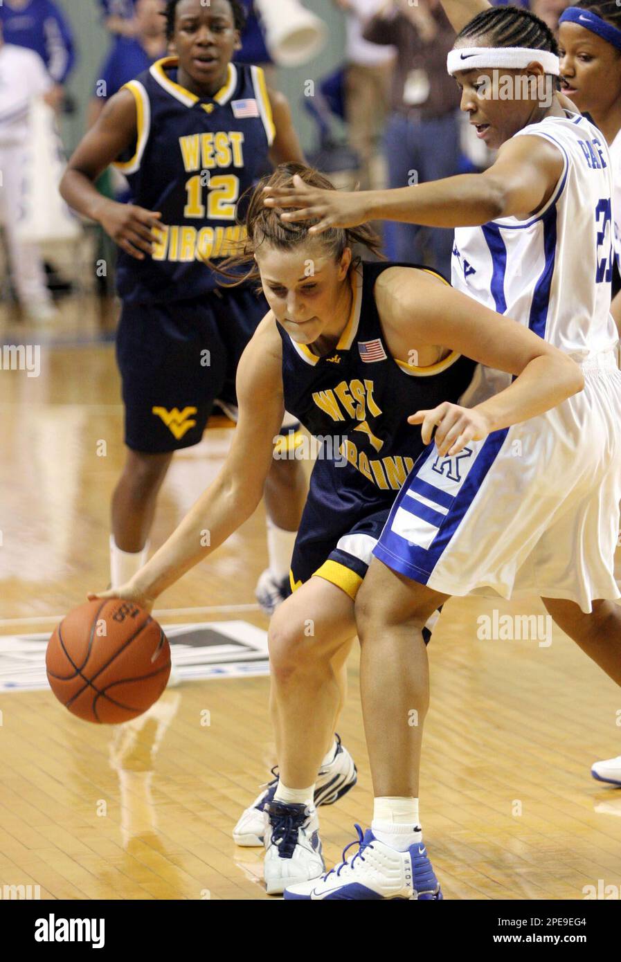 West Virginia's Meg Bulger, left, looks for an opening against Kentucky ...