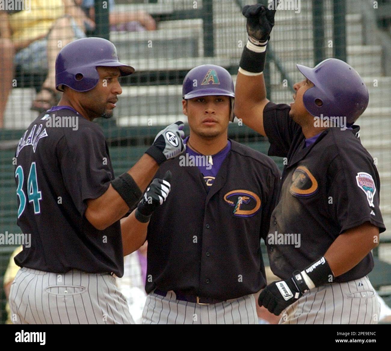 Arizona Diamondbacks Tony Clark, left, and Sergio Santos, center ...