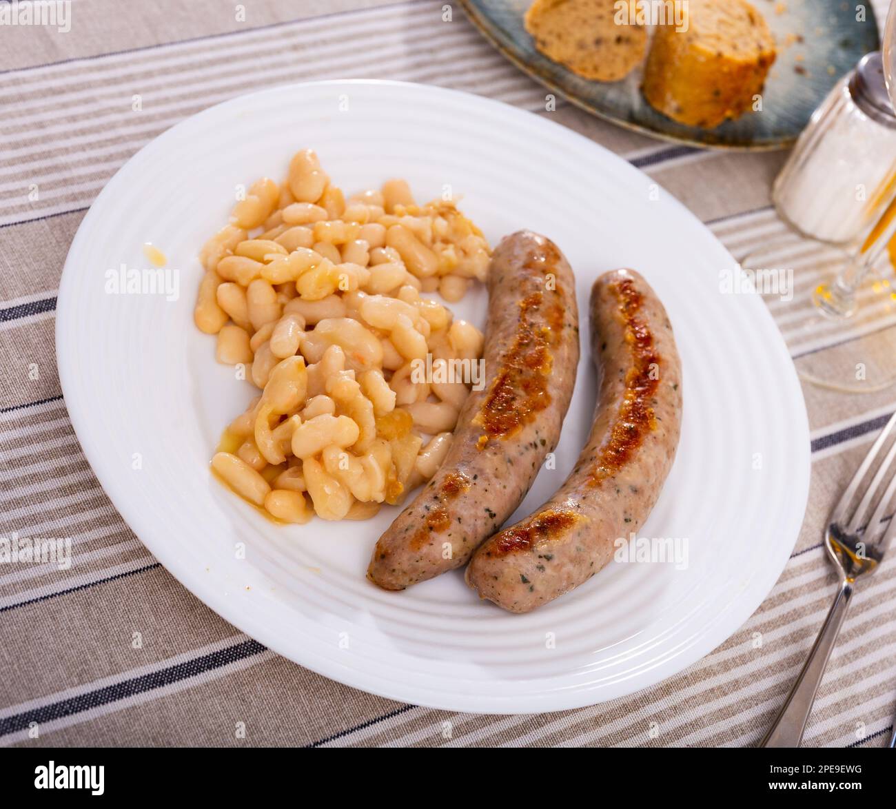 Traditional Catalan dish stewed beans with sausage. Butifarra con ...