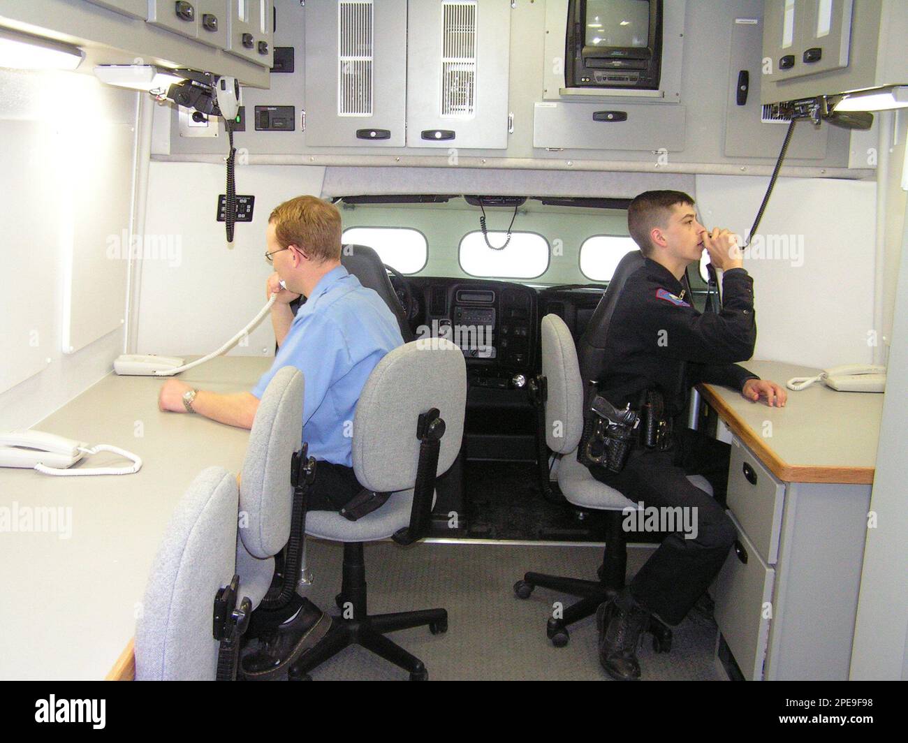 Storm Lake firefighter Josh Fevold, left, police officer John Koontz ...