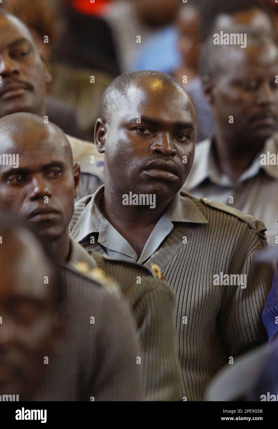 A Zimbabwean Police officer looks on as he receives training as an ...