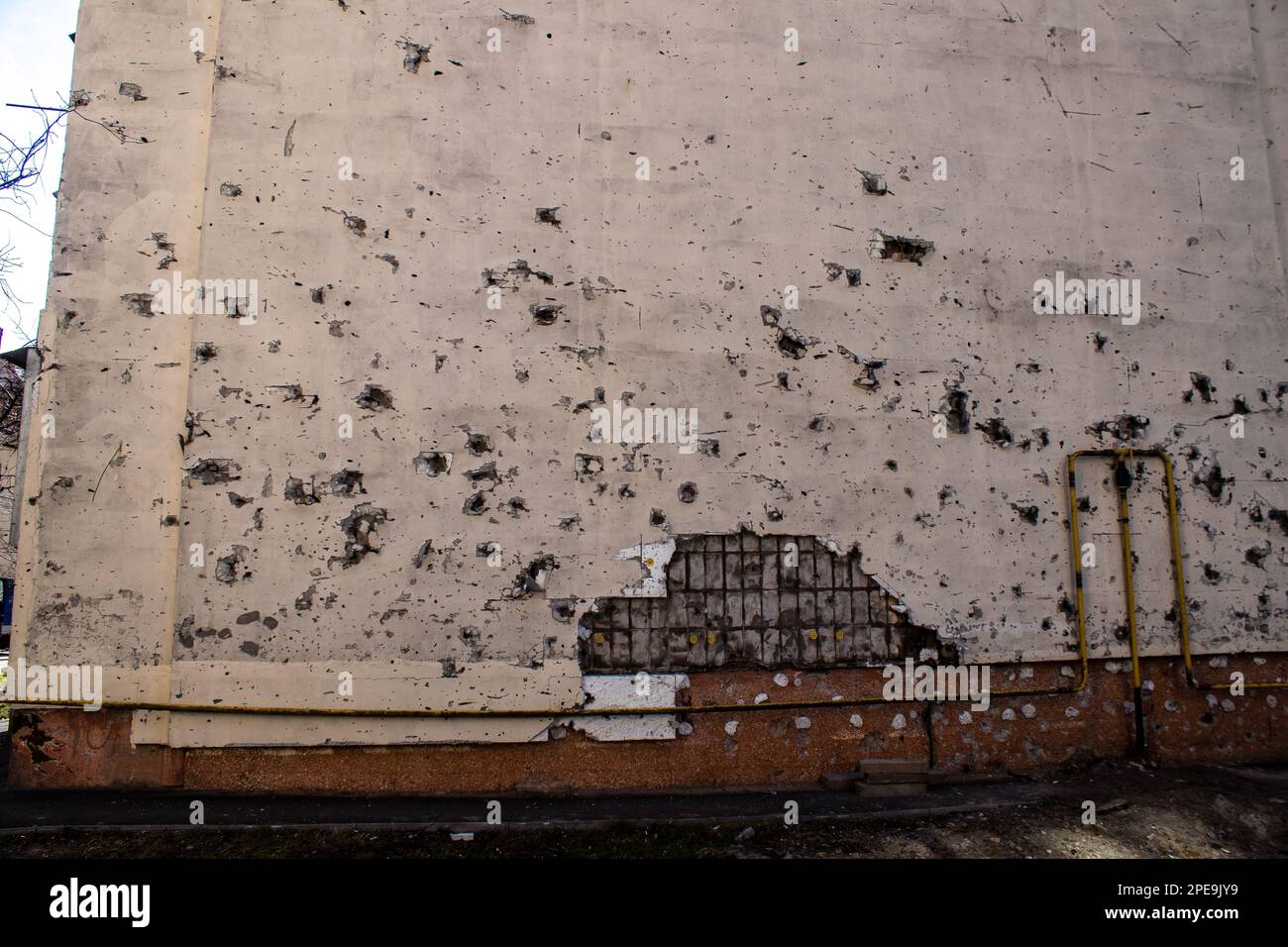 Shrapnel on the facade of a building following artillery fire. Most ...