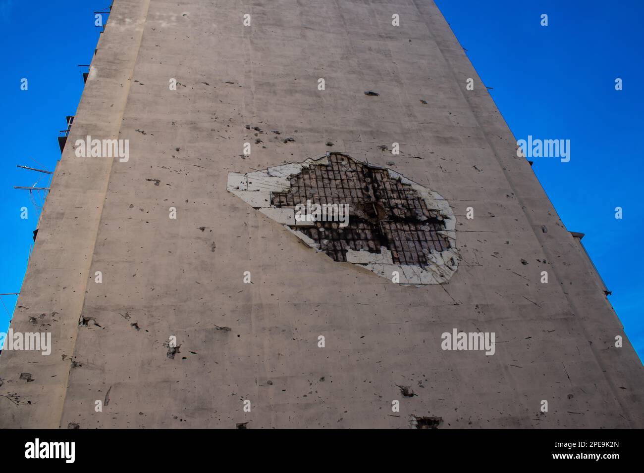 Shrapnel on the facade of a building following artillery fire. Most ...