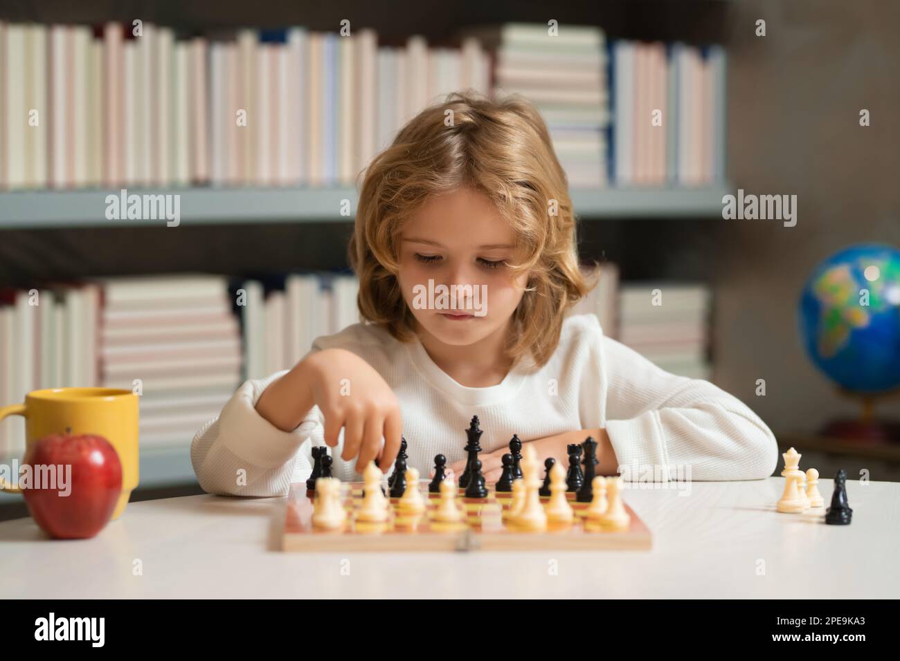 Little child chessman play chess game, checkmate. Kid playing chess in ...
