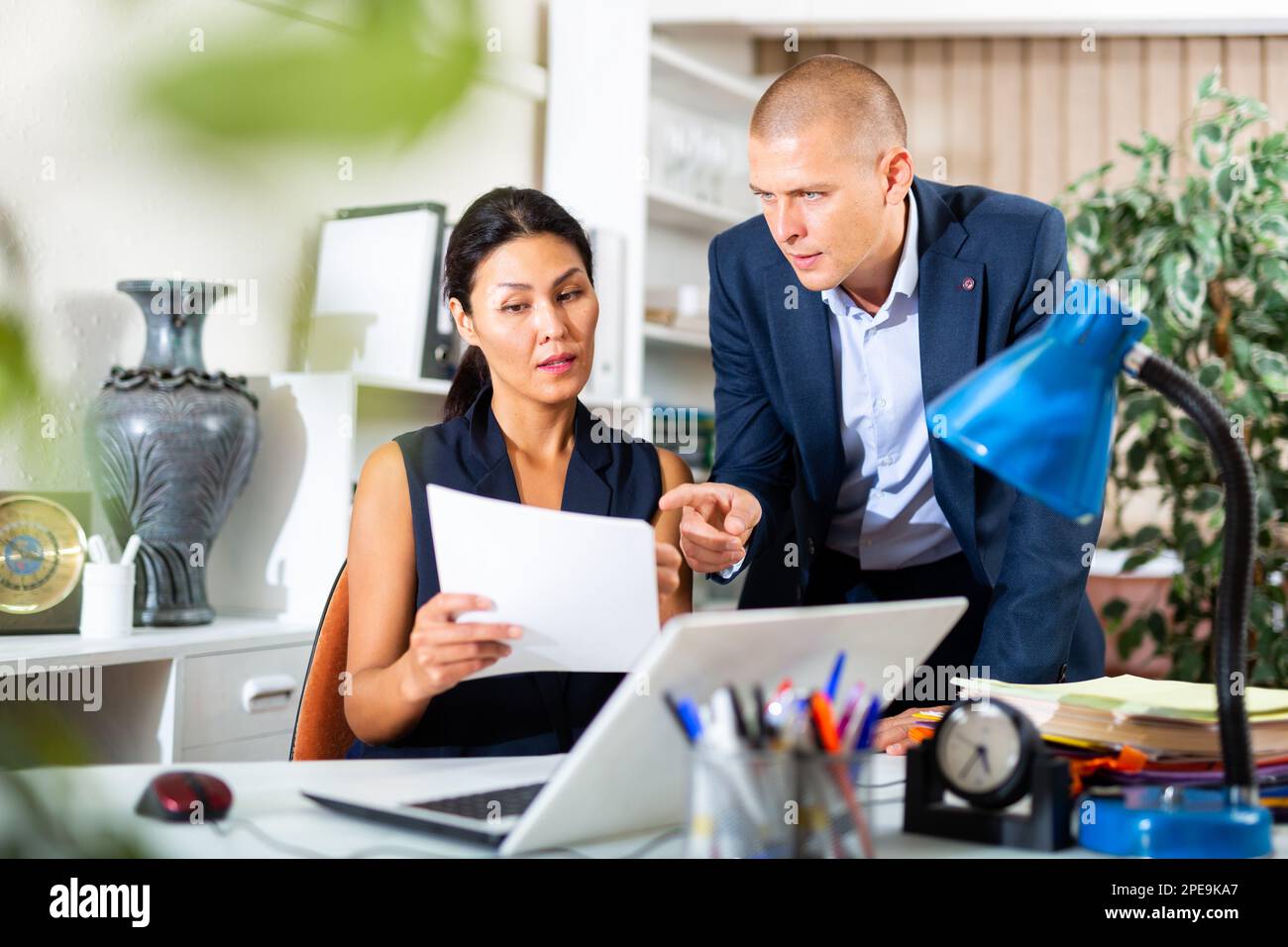 Business people working with papers together Stock Photo - Alamy