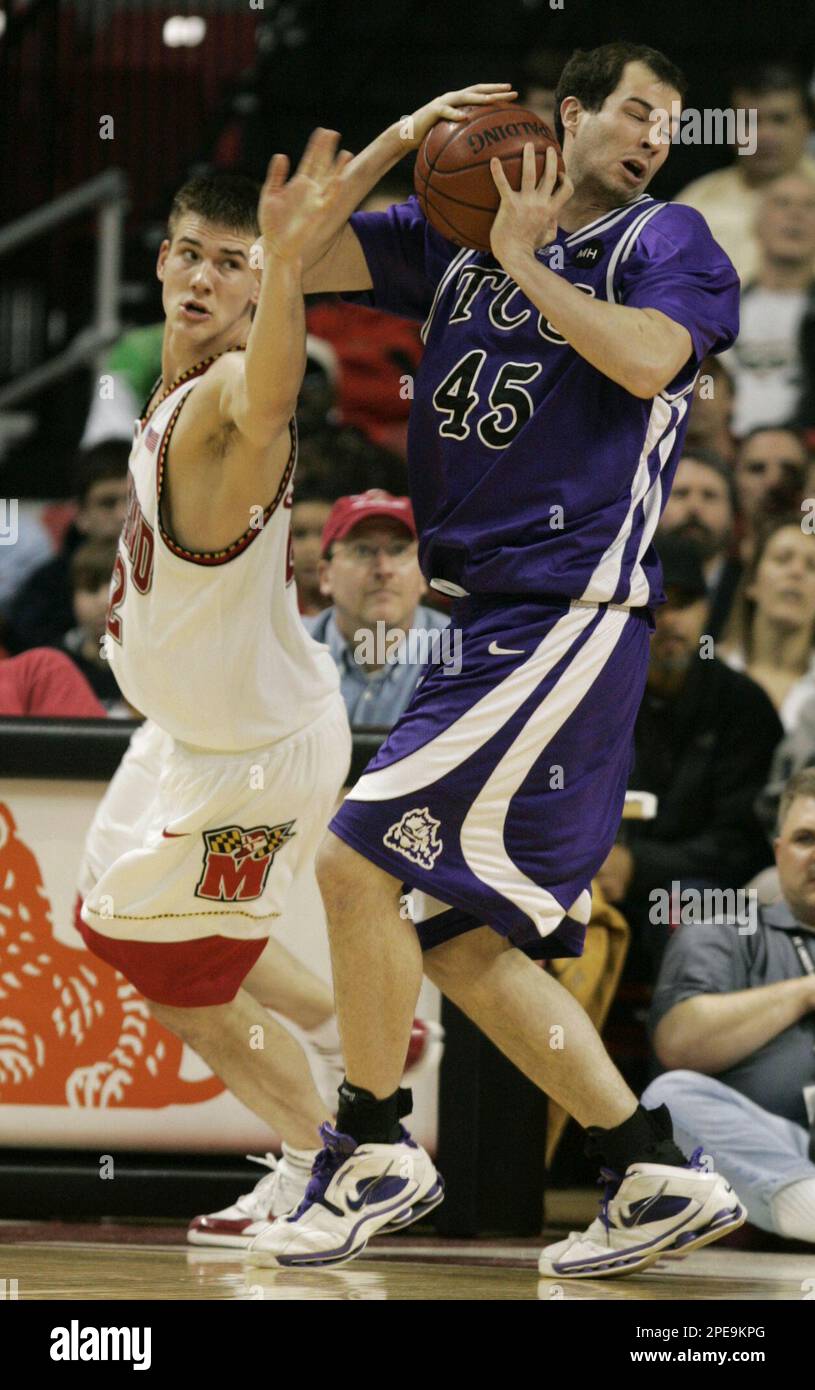 Maryland's Nik Caner-Medley, left, tries to steal the ball away from ...