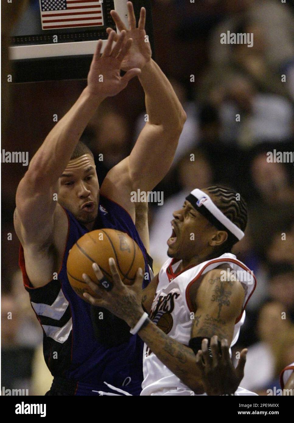 Philadelphia 76ers' Allen Iverson, right, has his path to the basket ...