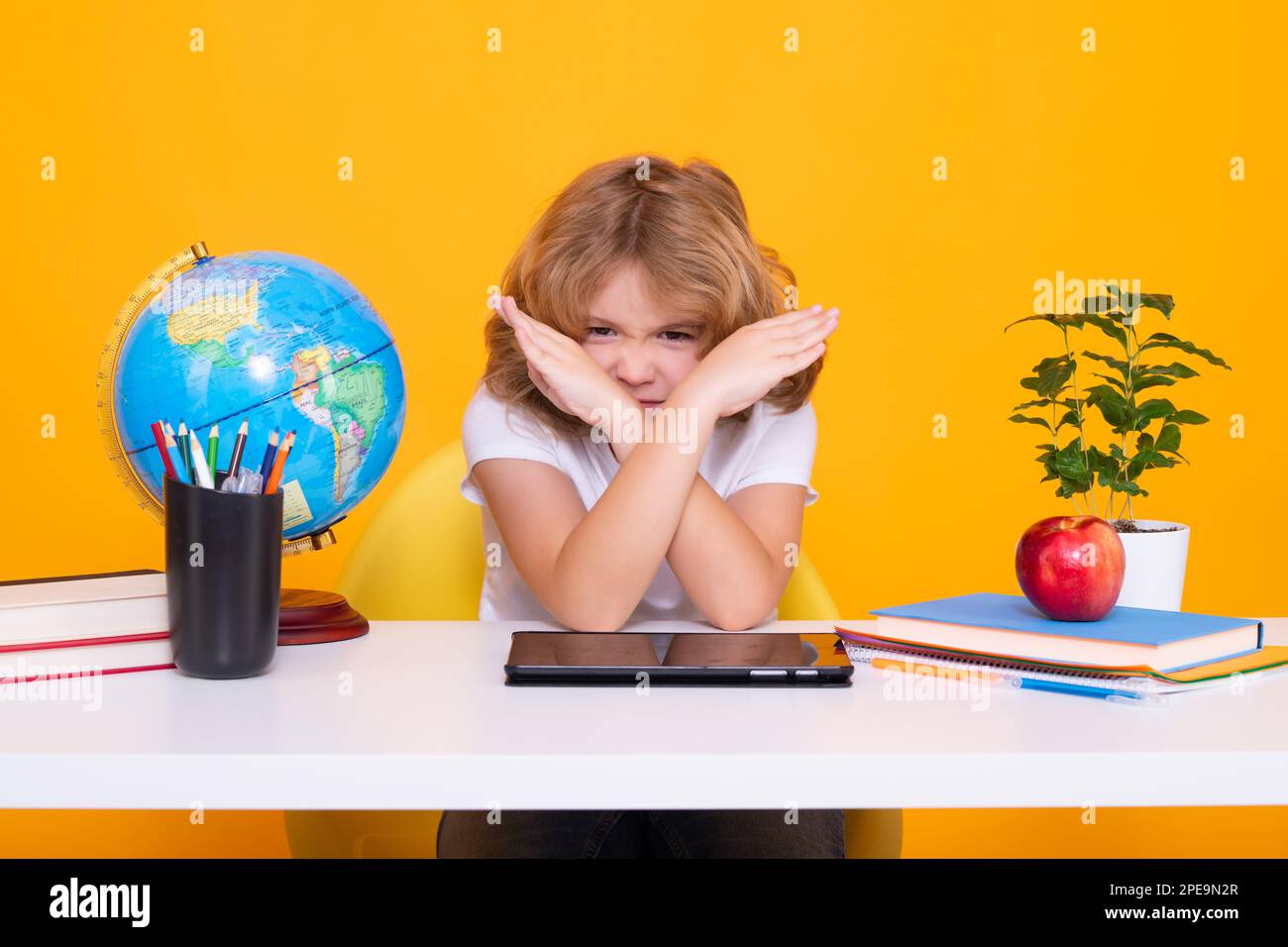 Stop bullying. Sad and angry pupil. School child studying in classroom ...