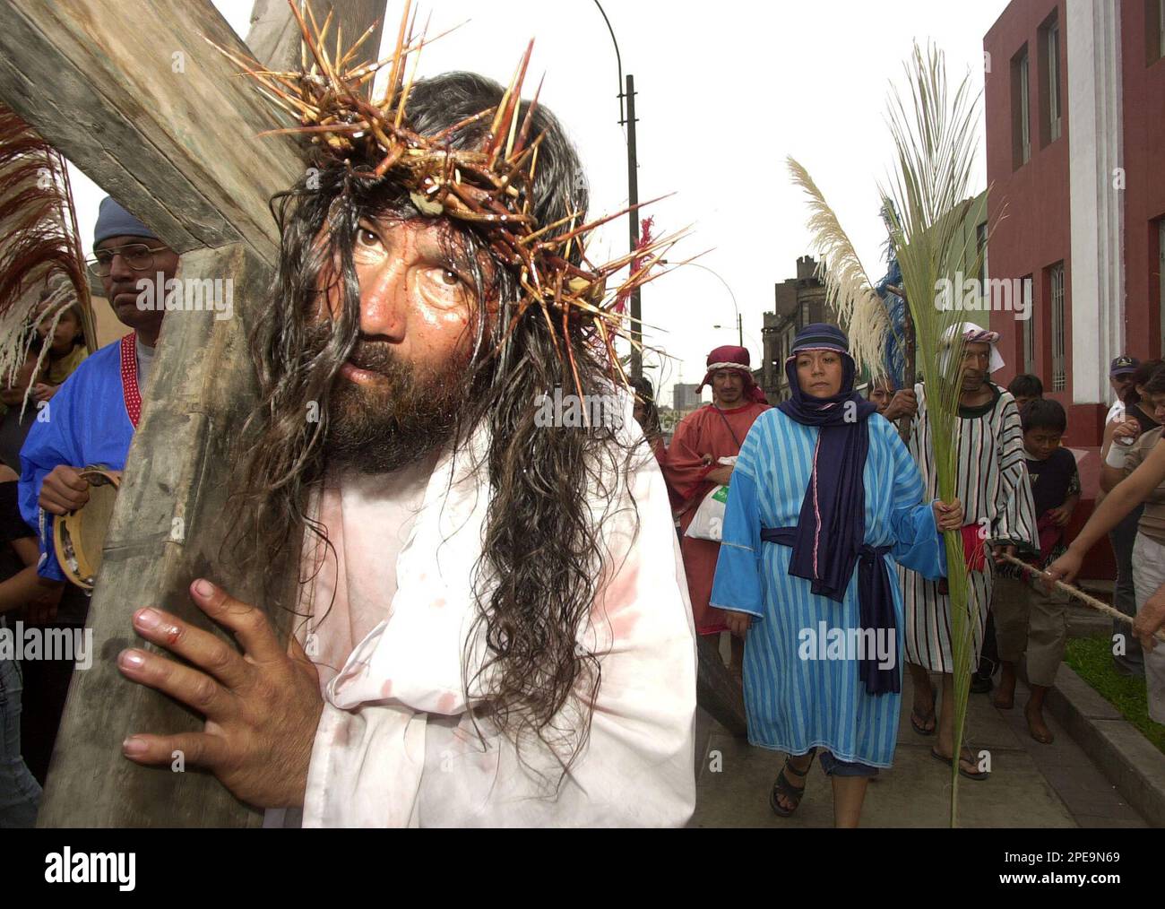 Peruvian Mario Valencia, partakes in a re-enactment of the crucifixion ...