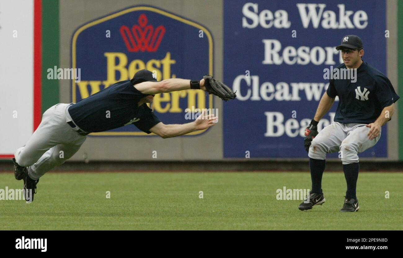 New York Yankees outfielder Bubba Crosby watches as left fielder Colin ...