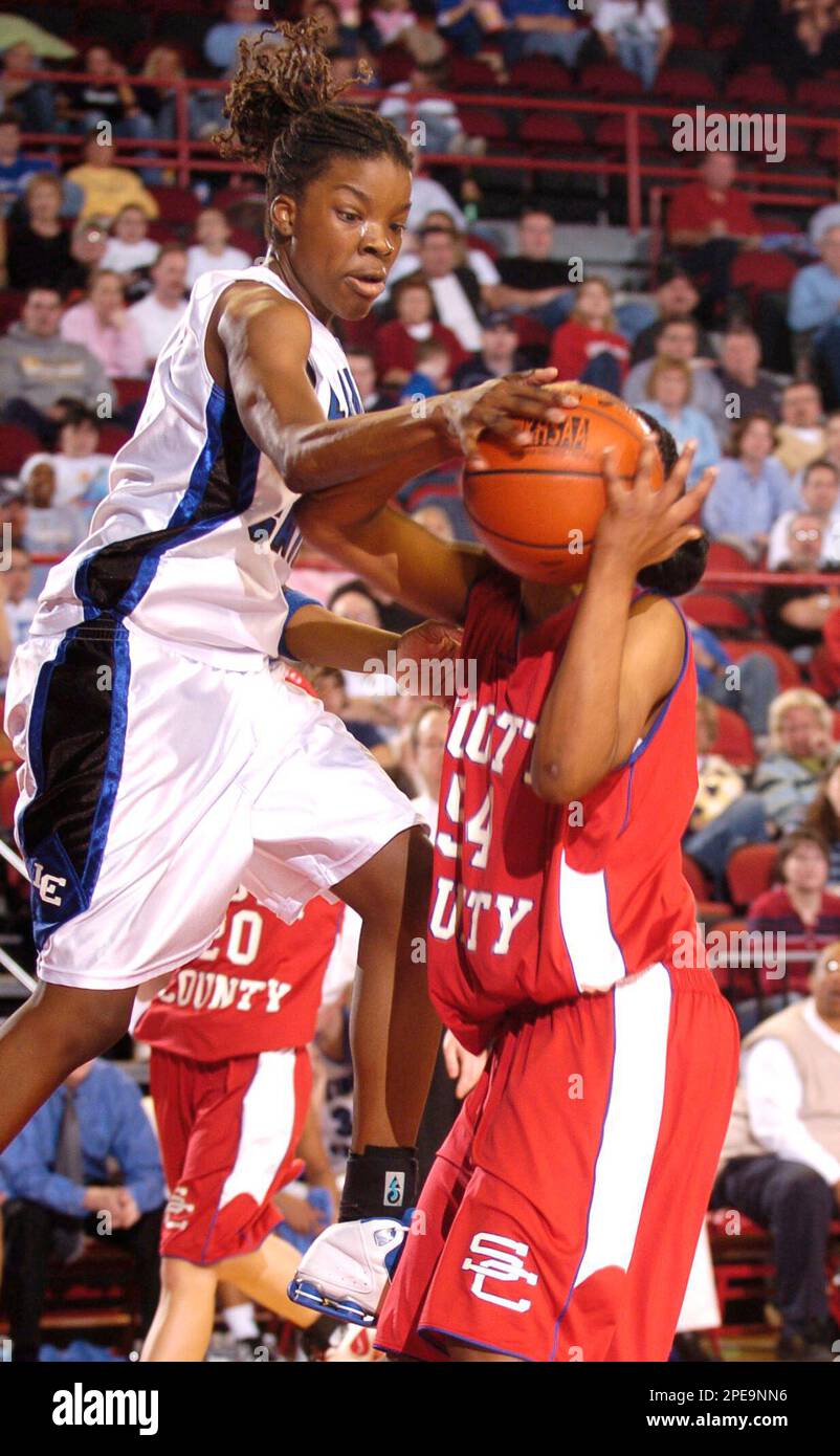 Lexington Catholic's Adaeze Azubuike, left, blocks the shot of Scott ...