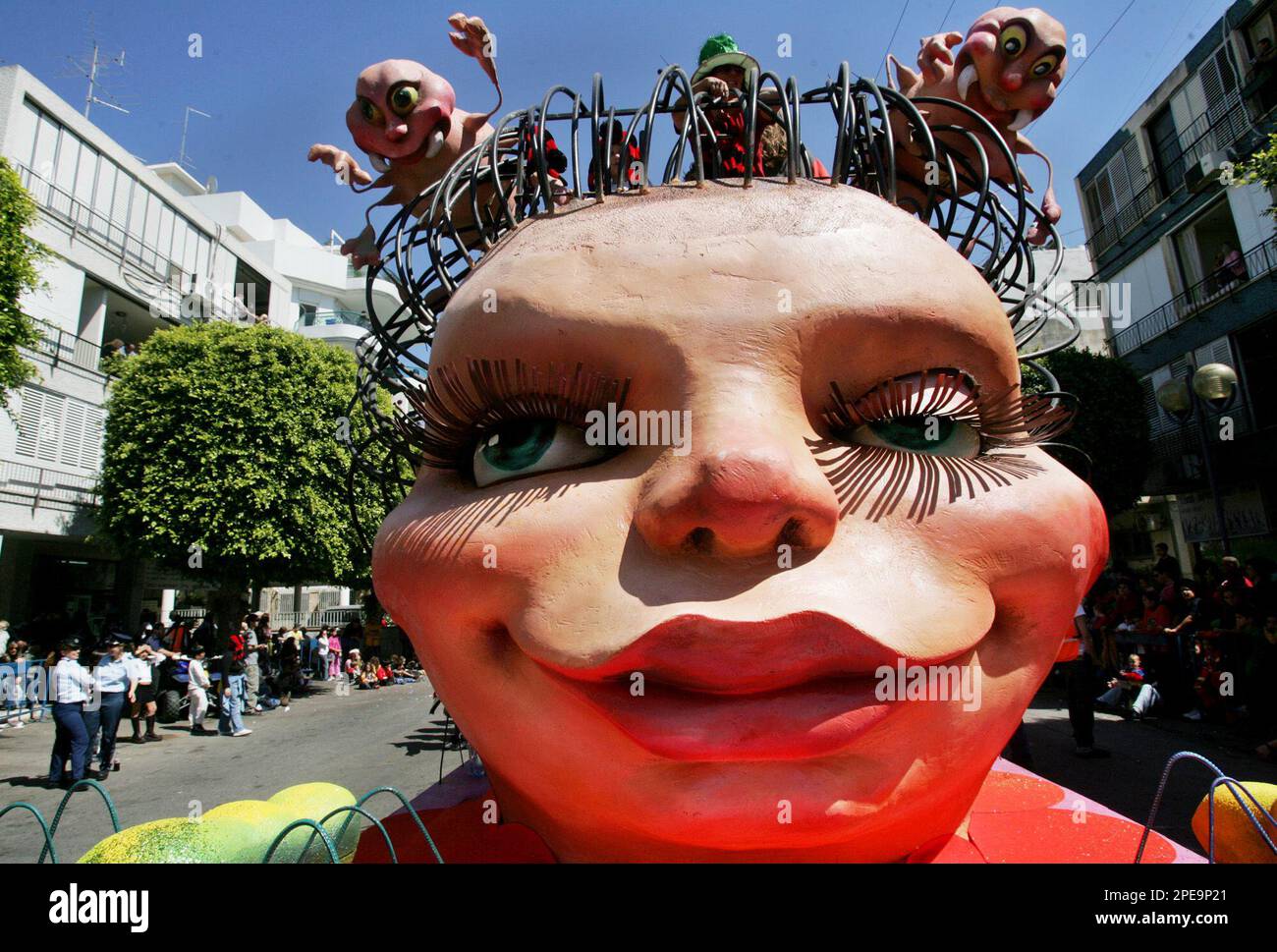 A parade float makes it's way through the street as part of the country ...