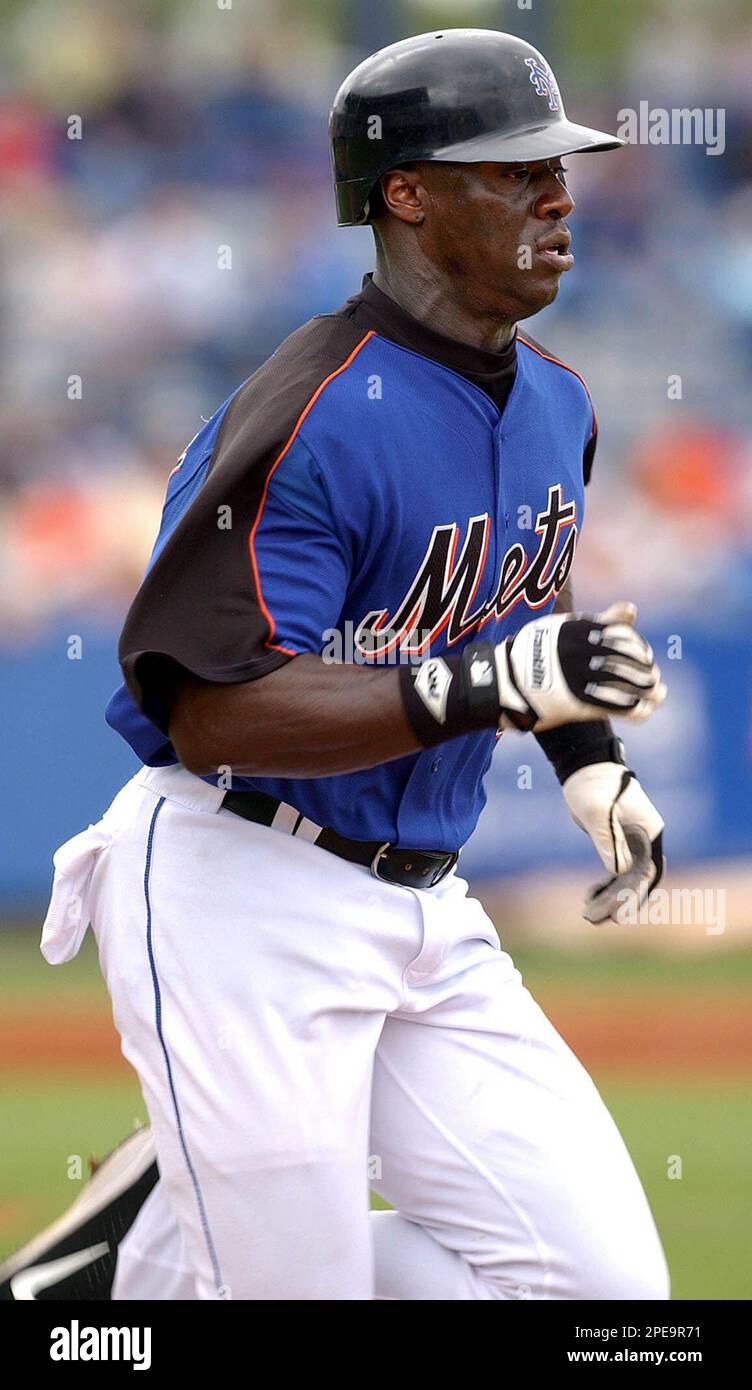 New York Mets' Mike Cameron (44) runs out an infield hit for an out at ...