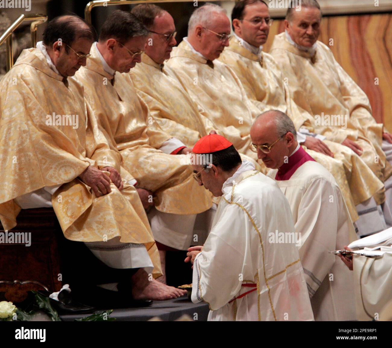 Cardinal Alfonso Lopez Trujillo, center, approaches a group of barefoot ...