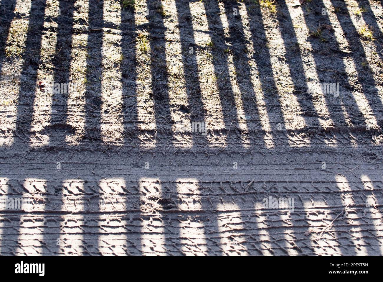 Shadow fence and tire trackstrace hi-res stock photography and images ...