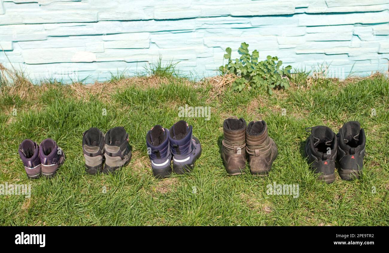 5 pairs of shoes in back Stock Photo - Alamy