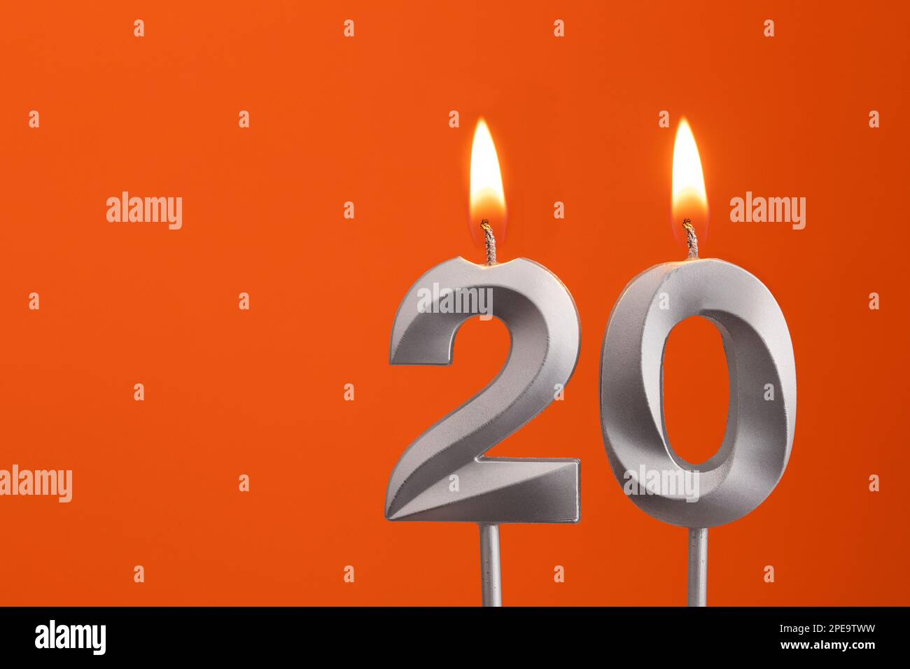 Candle number 20 - Birthday in orange background Stock Photo - Alamy