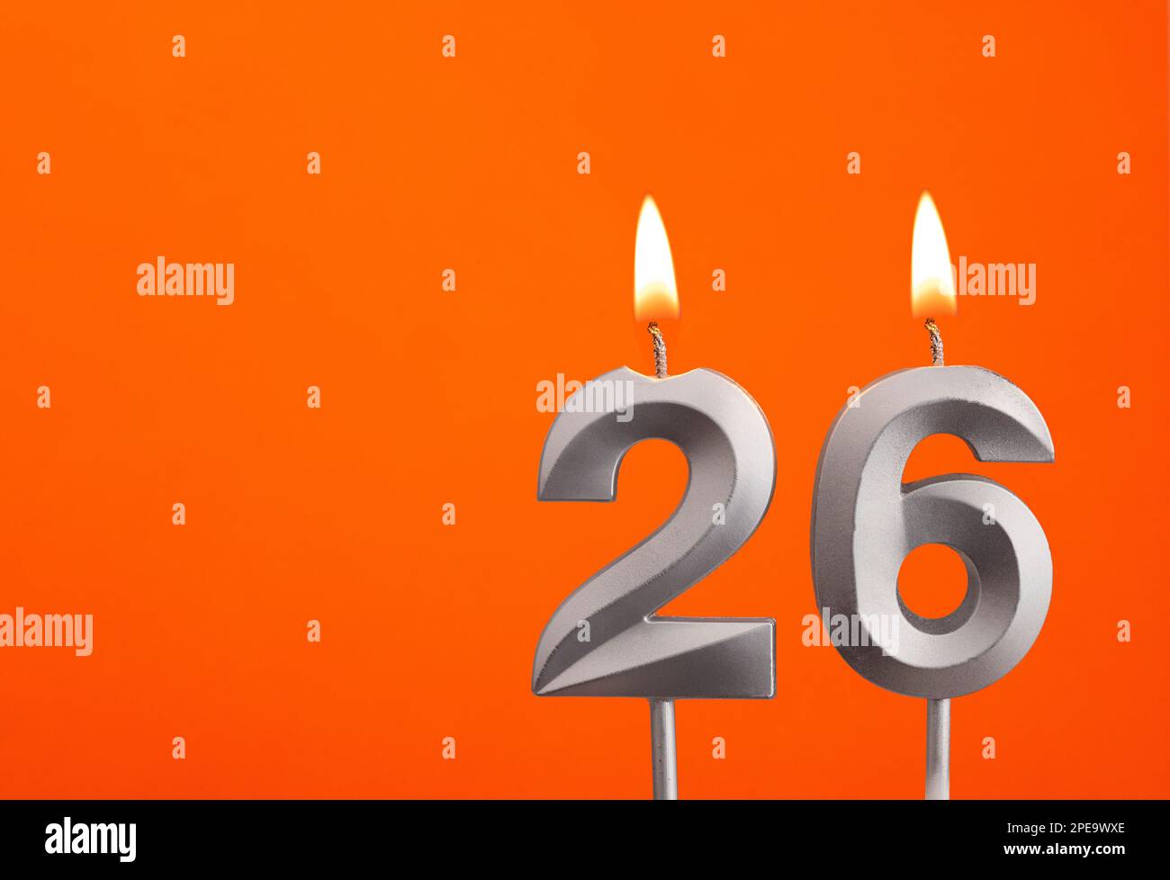 Candle number 26 - Birthday in orange background Stock Photo - Alamy